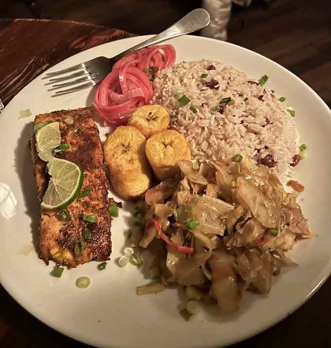 Perfectly seasoned salmon with rice, plantains, and slaw creates a plate that's almost too pretty to eat.