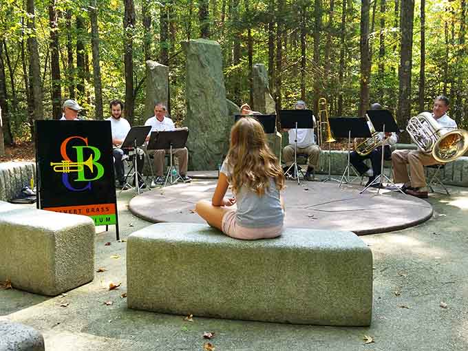An outdoor amphitheater where brass bands meet forest serenity&mdash;Mozart would approve of this woodland venue.