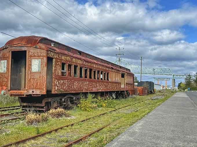 This rusty railcar sits as a monument to Astoria's industrial past, weathered but still standing with dignity.