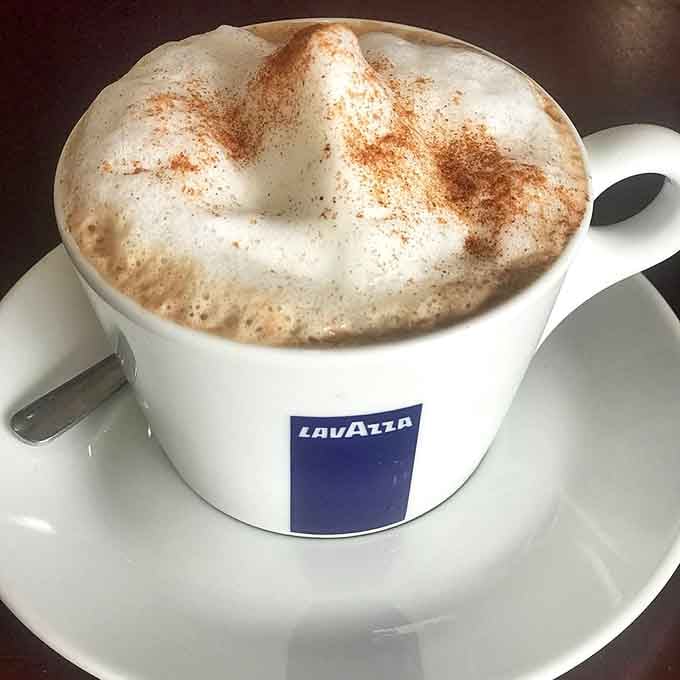 That cappuccino foam looks like a cloud you'd actually want to sleep on after this incredible meal.