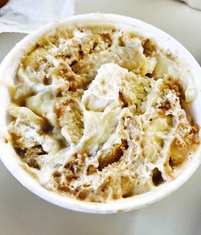 Banana pudding topped with clouds of whipped cream, because every great meal deserves a sweet Southern finale.