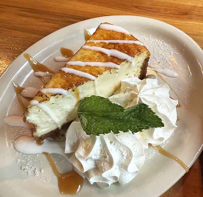Cheesecake drizzled with caramel and topped with whipped cream is the sweet ending every great meal deserves.