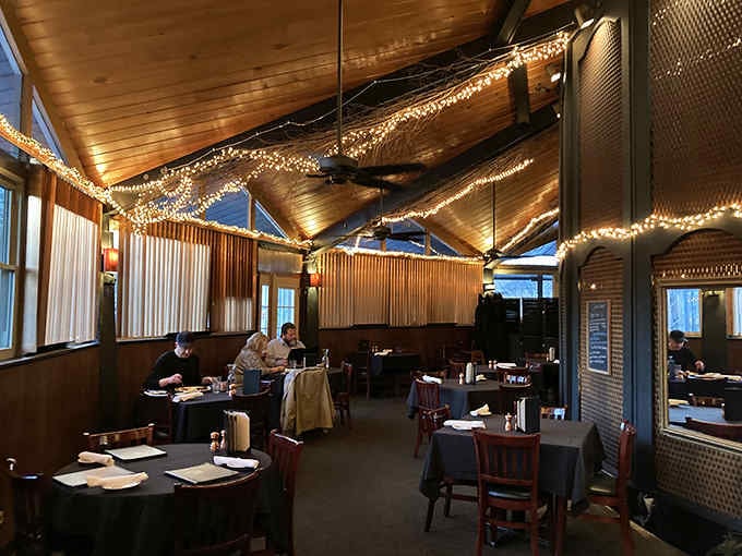 Vaulted ceilings draped in fairy lights transform dinner into something that feels like a celebration every single night.