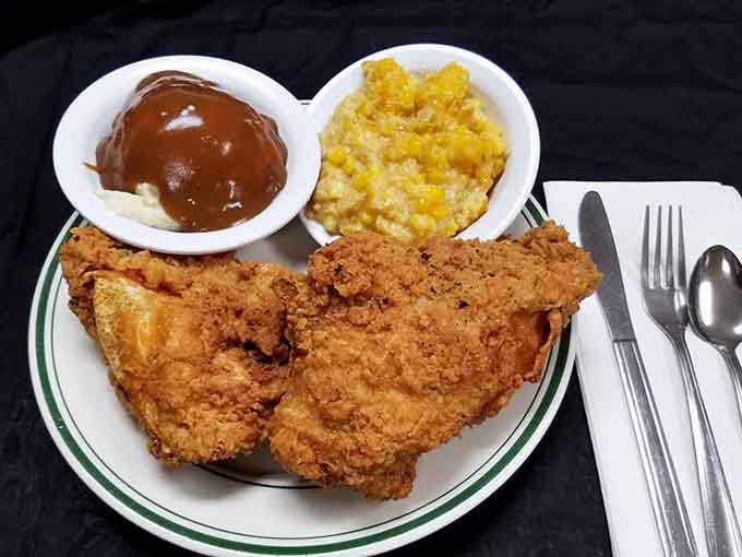 Fried chicken with sides that looks like Sunday dinner at grandma's, if grandma ran a professional kitchen operation.