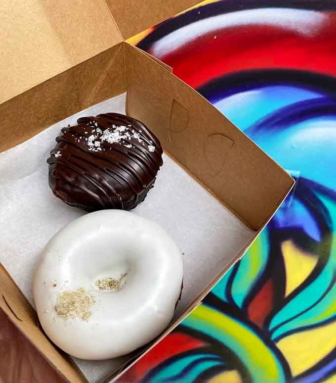 Two doughnuts walk into a box: one dark and mysterious, one light and lovely, both absolutely irresistible.