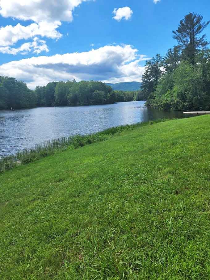 Manicured grass slopes meet pristine waters under endless blue skies, creating the kind of view that makes postcards jealous.