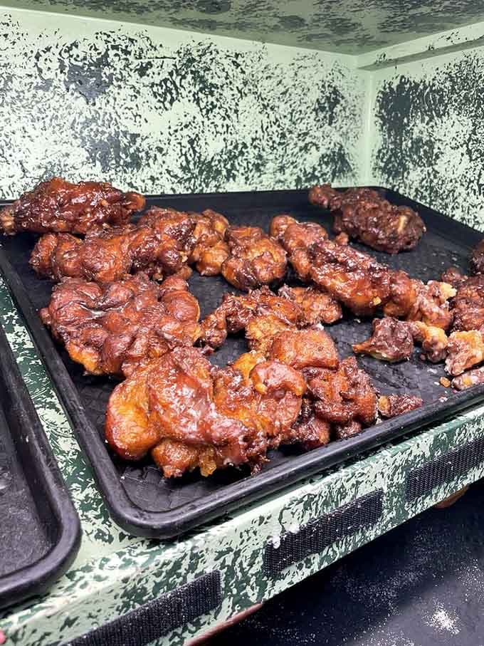 Apple fritters glistening on the tray, ready to make you forget every diet you've ever attempted.