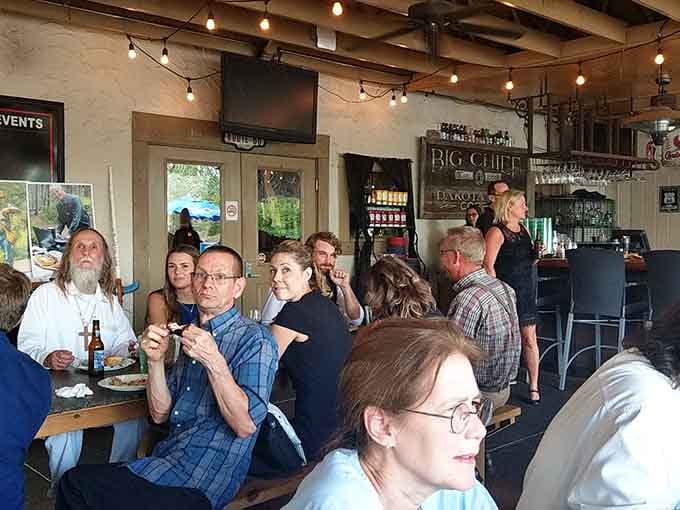 The dining room buzzes with conversation and laughter, proof that great food brings people together across generations and backgrounds.