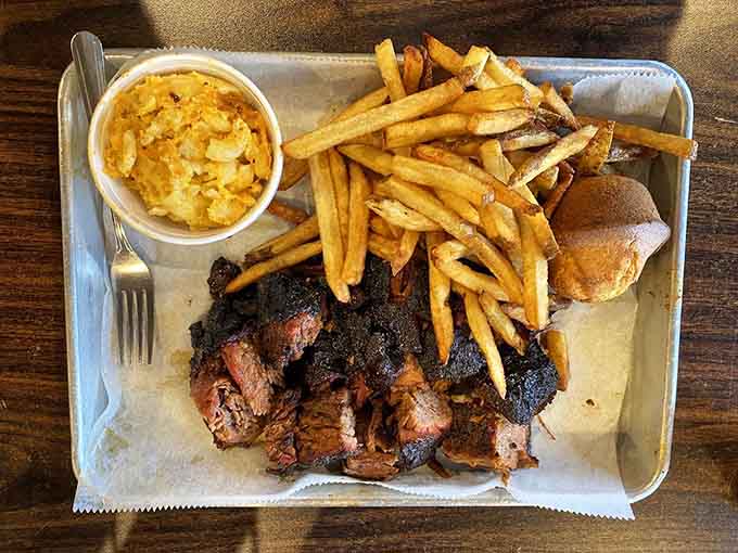 Smoky burnt ends with mac and cheese, fries, and a bun, proving that beef belly deserves equal billing.