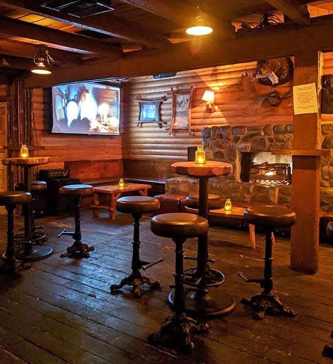 Wooden bar stools line up like loyal soldiers, ready to support your evening of questionable decisions and great stories.