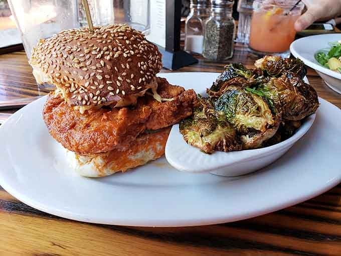 That sesame seed bun is barely containing what looks like the kind of fried chicken sandwich dreams are made of.