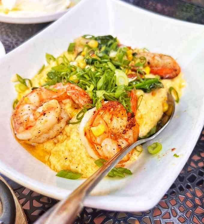 Plump shrimp nestled in creamy grits, Southern hospitality meets New England seafood in perfect harmony.