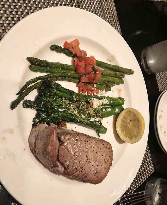 Perfectly seared ahi tuna with grilled asparagus proves that simple preparations often yield the most spectacular results.