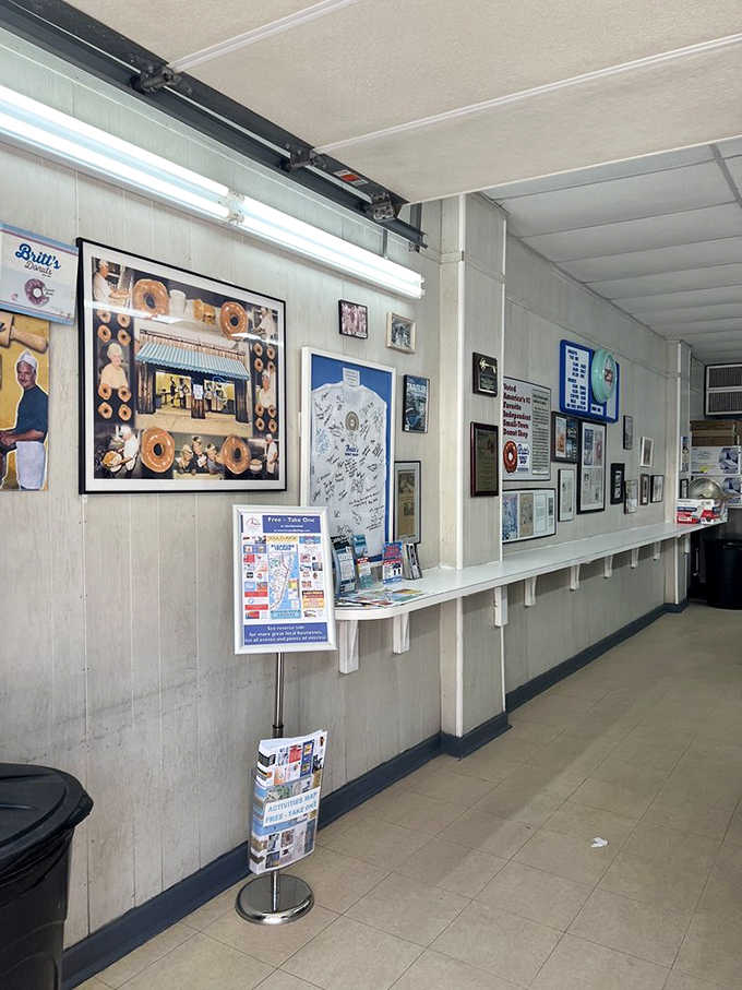 Framed memories and accolades line the walls, proof that greatness doesn't need fancy decor to shine.