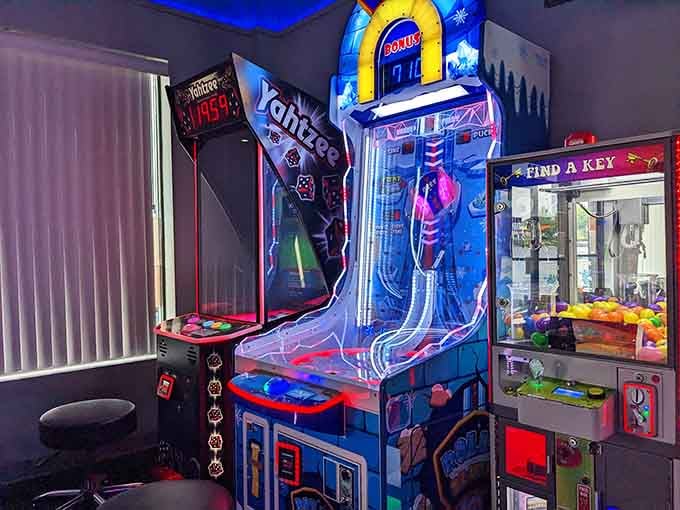 That towering slide game stands like a neon lighthouse guiding you toward tickets and questionable life choices about one more play.