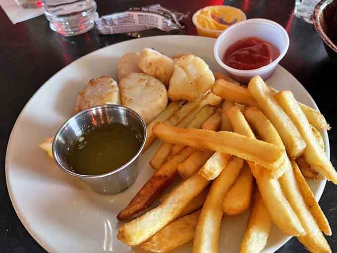 Golden scallops and crispy fries prove that surf and turf doesn't always need to include a steak.