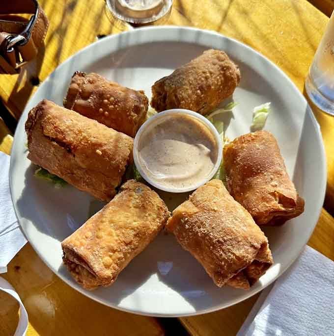 Buffalo chicken egg rolls bring fusion creativity to the table, wrapping wing flavors in a crispy golden package.