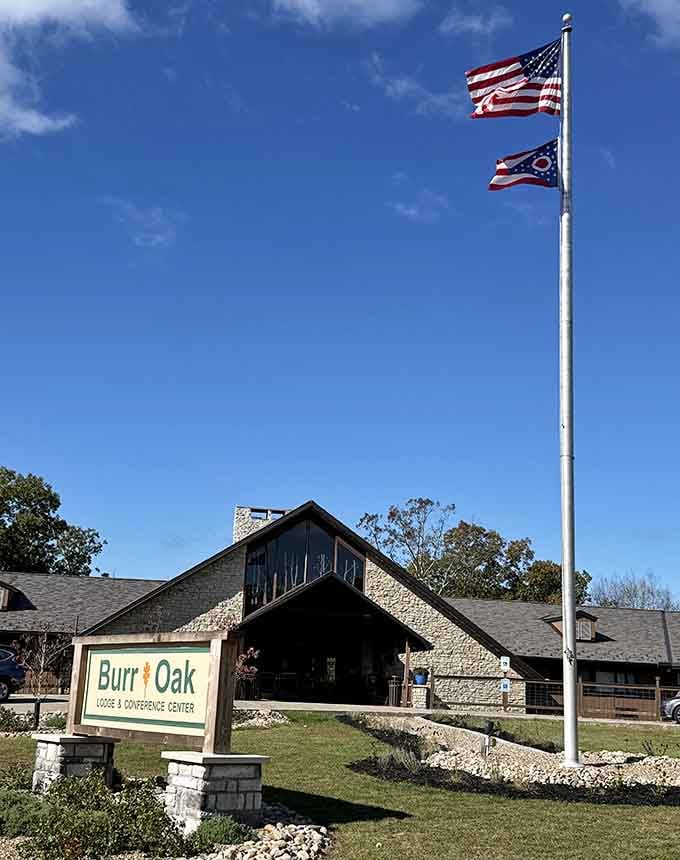 The lodge stands proud beneath flying flags, ready to welcome guests seeking comfort after outdoor adventures.