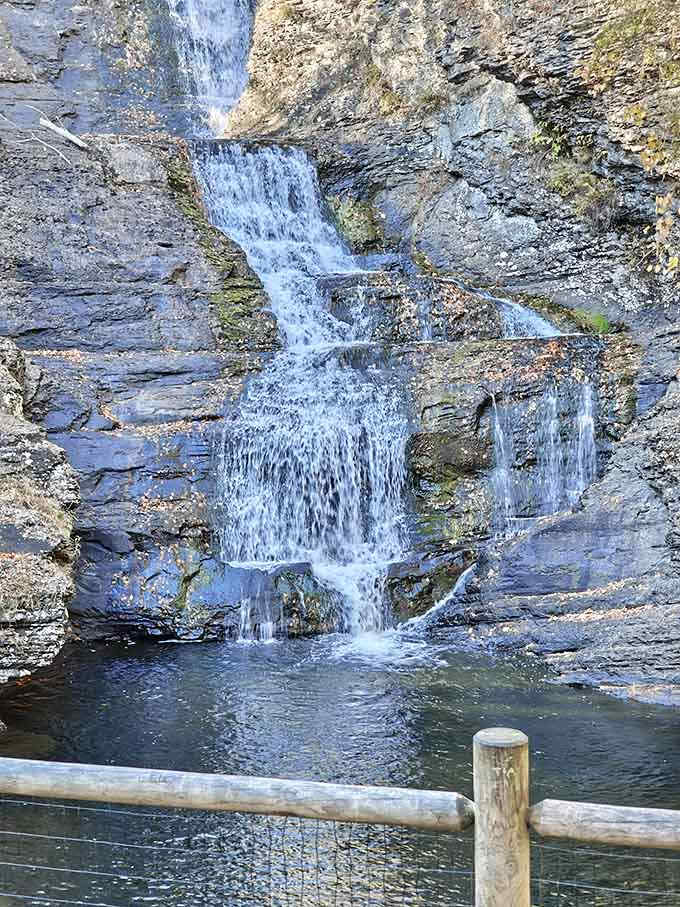 The waterfall's delicate tiers create a mesmerizing display, proving good things really do come in layers.