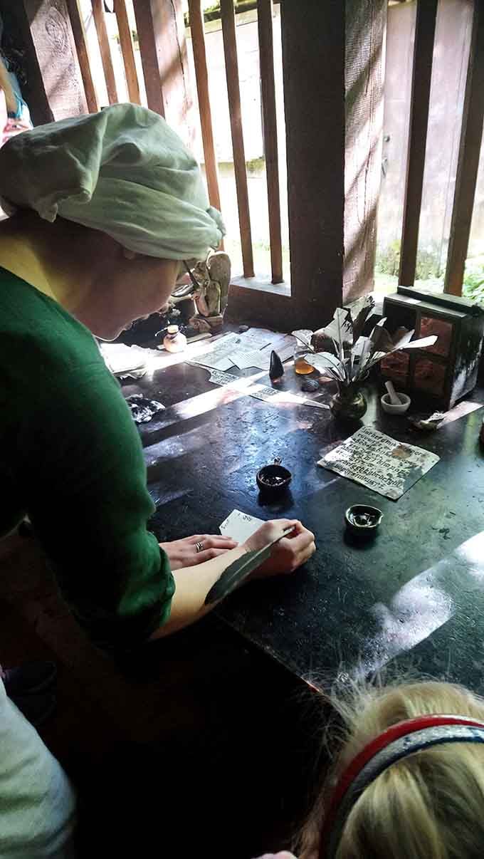 A scribe practices the lost art of quill writing, making your worst handwriting look positively contemporary.