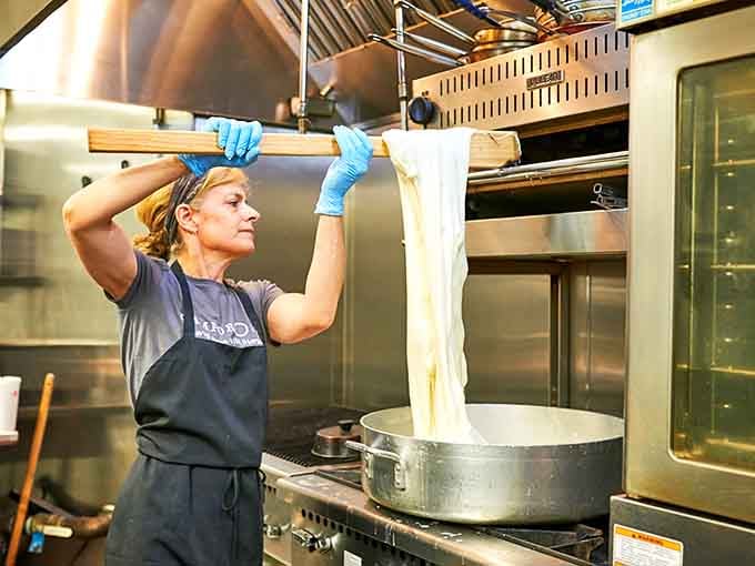 Watching dough being stretched to impossible lengths is oddly mesmerizing, like pizza-making performance art you can eat.