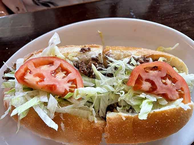 This cheesesteak sub bridges Italian and Philly traditions, loaded with meat, cheese, and vegetables for maximum satisfaction.