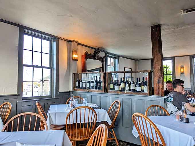 Windsor chairs and white tablecloths create the perfect setting for your historic dining adventure in Mystic.