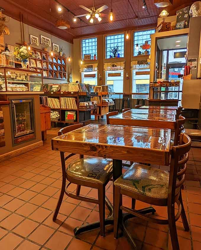 Cozy tables nestled among vinyl bins create the perfect spot for lingering over coffee and music discoveries.