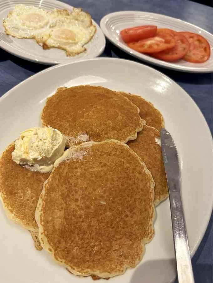 Buttermilk pancakes so fluffy they practically float off the plate, making your morning carb dreams come gloriously true.