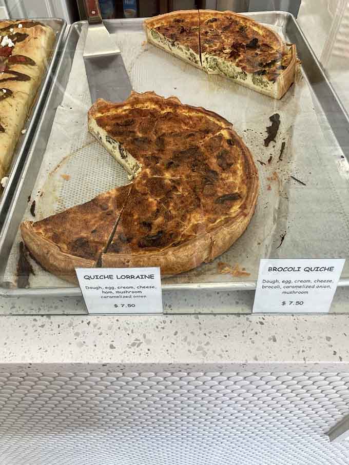 Quiche Lorraine and broccoli quiche proving that eggs, cheese, and buttery crust solve most of life's problems.