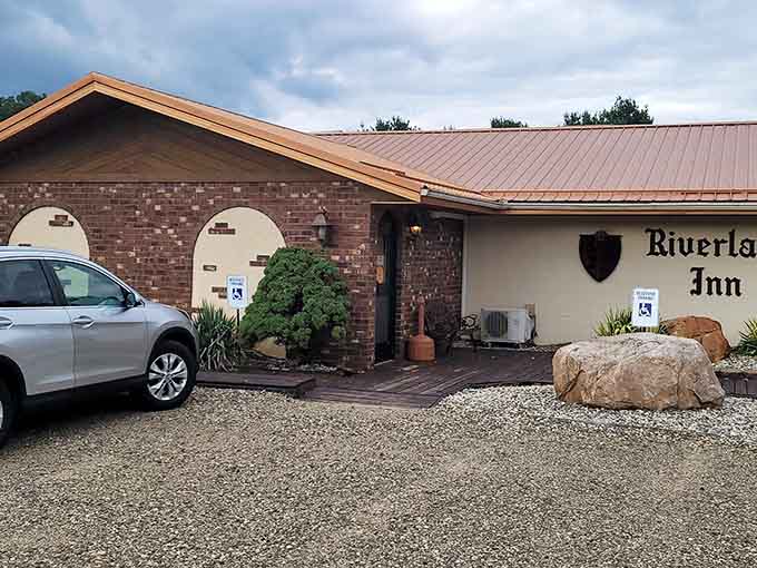 Brick and copper roofing signal the kind of roadside hospitality that existed long before chain hotels homogenized everything.