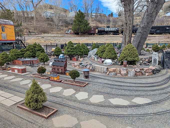 The outdoor garden railway winds through miniature landscapes, delighting engineers of all ages and sizes.