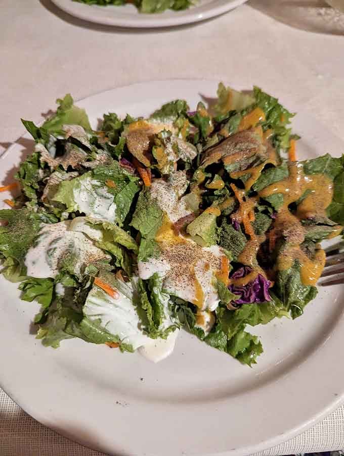 A crisp, colorful salad dressed to perfection, because even cowboy dinners need a little green to balance all that glorious protein.