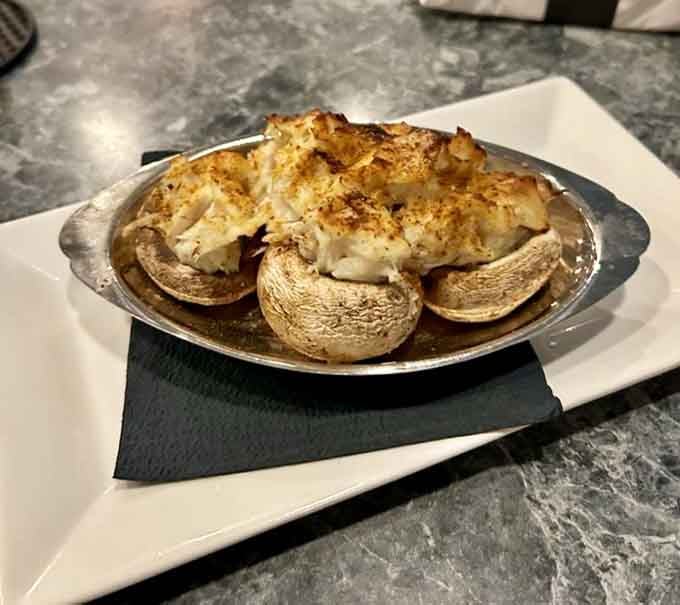 Crab-stuffed mushrooms nestled in their caps like little treasure chests of flavor waiting to be discovered.