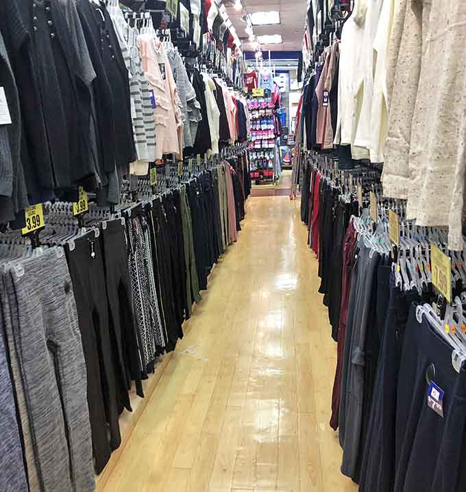 Women's clothing racks stretching into the distance like a fashionista's fever dream, minus the fever-inducing price tags.