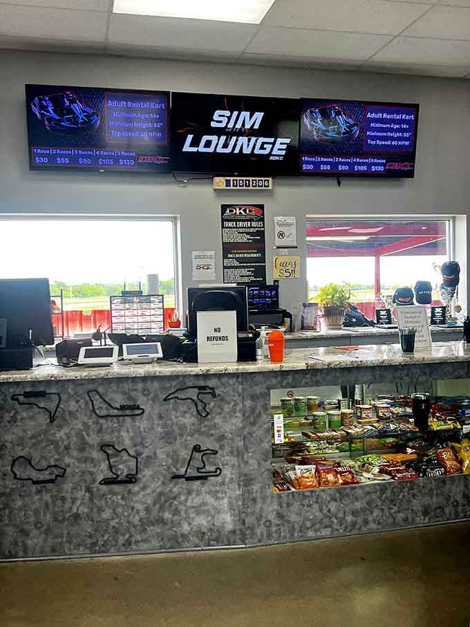 The front desk where racing dreams begin, complete with snacks for fuel and trophies for inspiration.