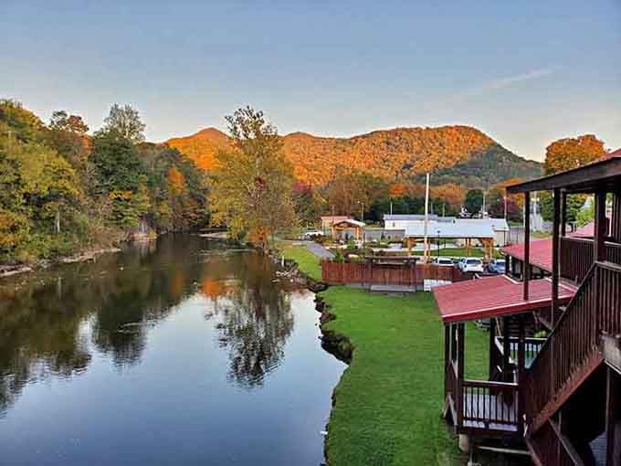Golden hour paints the ridges while the river mirrors the sky, creating twice the beauty for half the effort.
