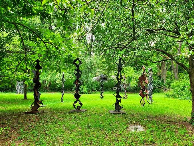 Delicate hanging pieces sway gently among the trees, proving that heavy metal can have surprisingly graceful moments too.