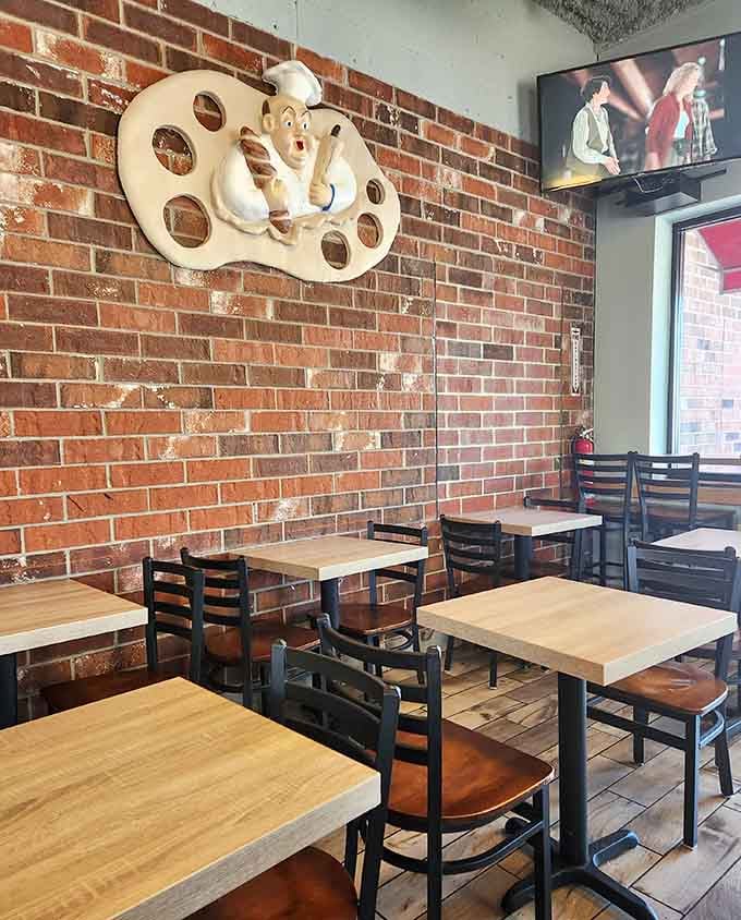 Whimsical pretzel decor on brick walls creates the perfect backdrop for serious sandwich consumption and contemplation.