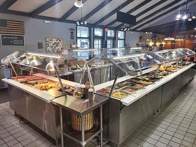 The buffet station stretches out like a steam-table symphony, each section playing its own delicious tune for hungry diners.