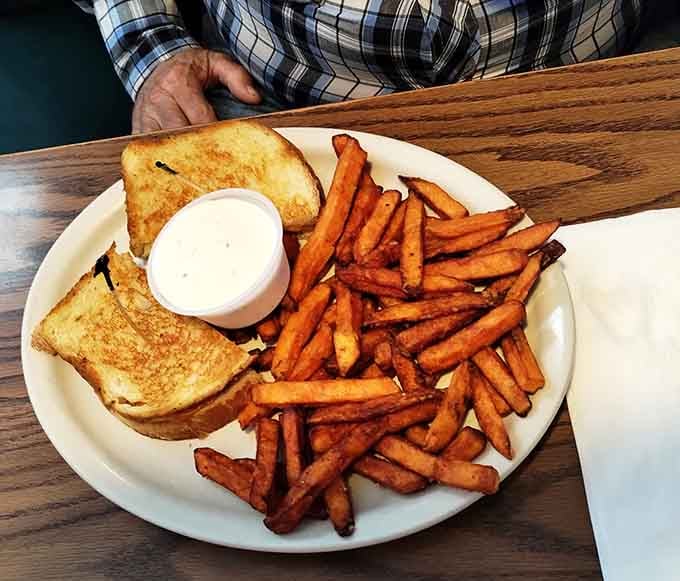 Grilled ham and cheese with sweet potato fries proves lunch here rivals the breakfast fame.