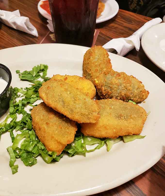 Golden jalape&ntilde;o poppers lined up like little soldiers of deliciousness ready to defend your taste buds.