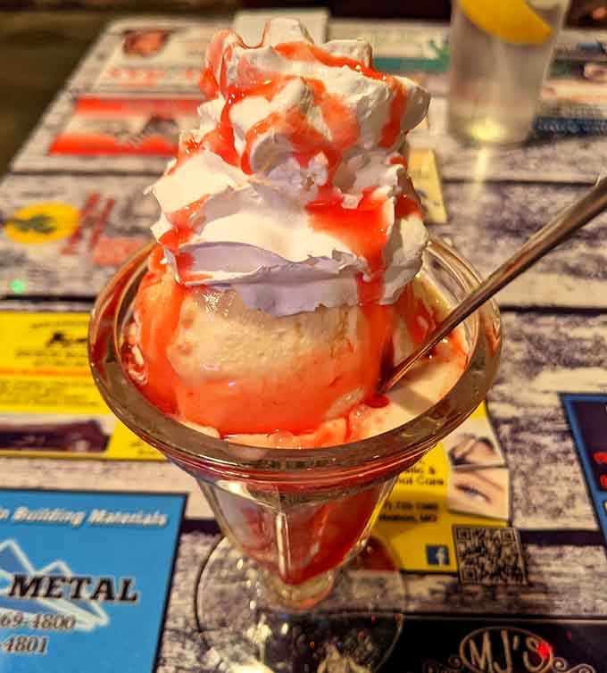 That strawberry sundae is piled so high it defies physics, gravity, and any notion of reasonable portion sizes &ndash; bless them.