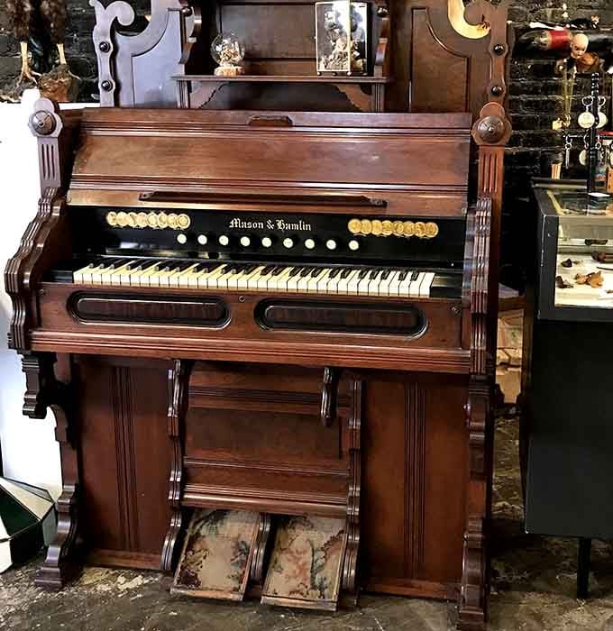 An antique pump organ stands ready to soundtrack your shopping experience, though it's seen better musical days, admittedly.