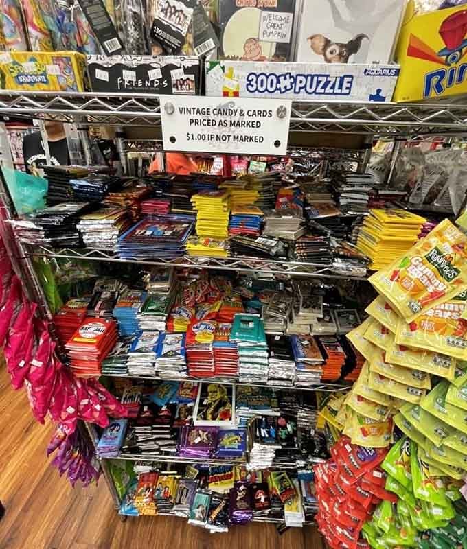 Vintage candy bars share shelf space with puzzles, because apparently nostalgia comes in multiple delicious forms.