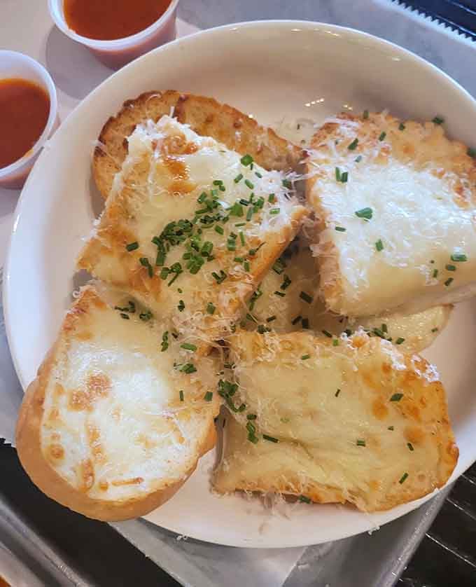 Golden, bubbling cheese bread with fresh chives is the kind of starter that makes you reconsider your main course.