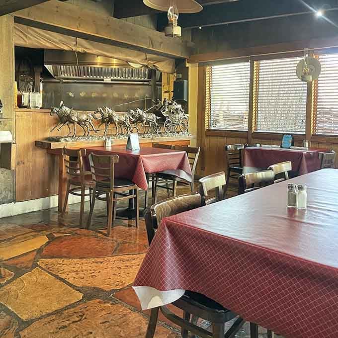 Decorative horse sculptures and warm lighting set the stage for a dining experience that feels authentically Southwestern.