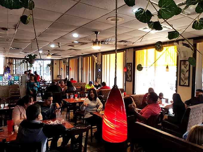 Happy diners in a space that feels festive without trying too hard, just good vibes all around.