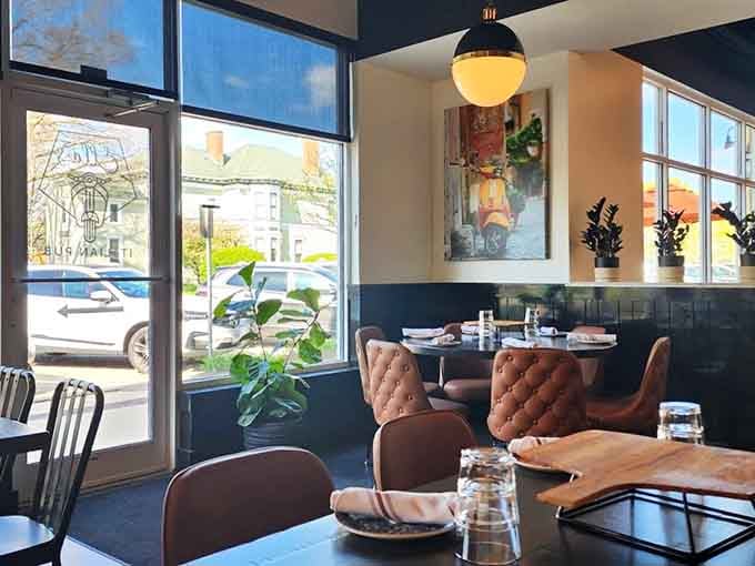 Tufted leather chairs and abundant natural light make every seat feel like the best seat in the house.