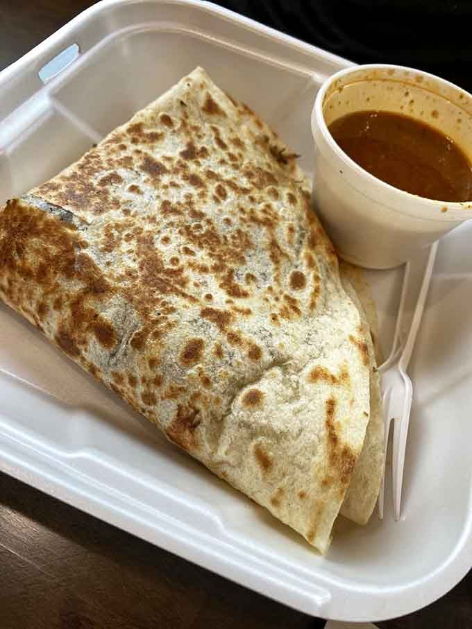 A perfectly griddled quesadilla with consomm&eacute; on the side&mdash;simple, satisfying, and absolutely worth the trip.